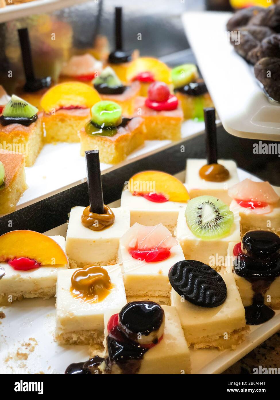 mix mini cakes & sweets with fresh fruits & glazed topping Stock Photo ...