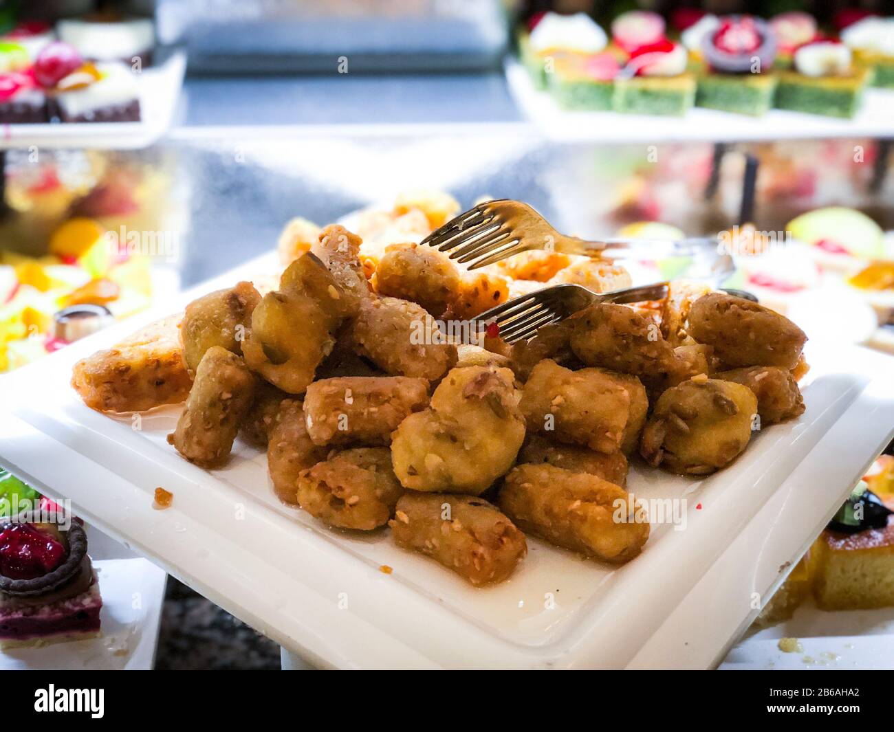 mix mini cakes & sweets with fresh fruits & glazed topping Stock Photo ...
