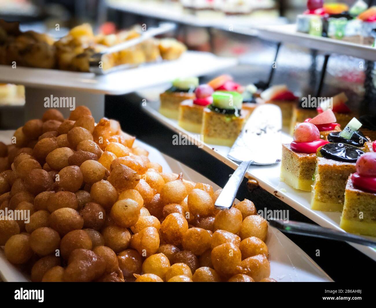 mix mini cakes & sweets with fresh fruits & glazed topping Stock Photo ...