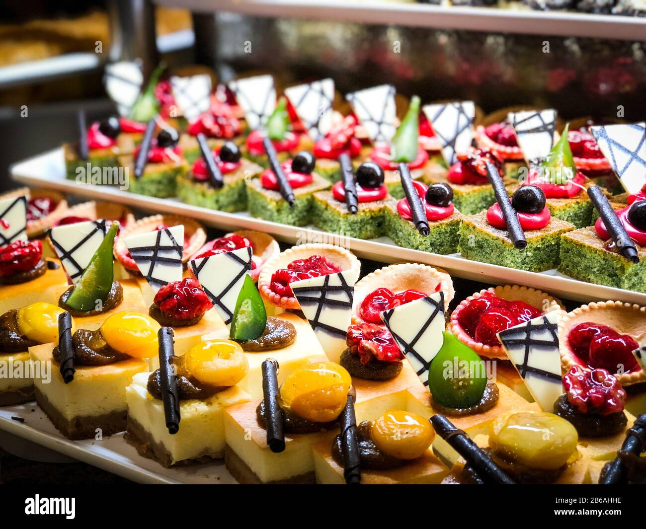 mix mini cakes & sweets with fresh fruits & glazed topping Stock Photo ...