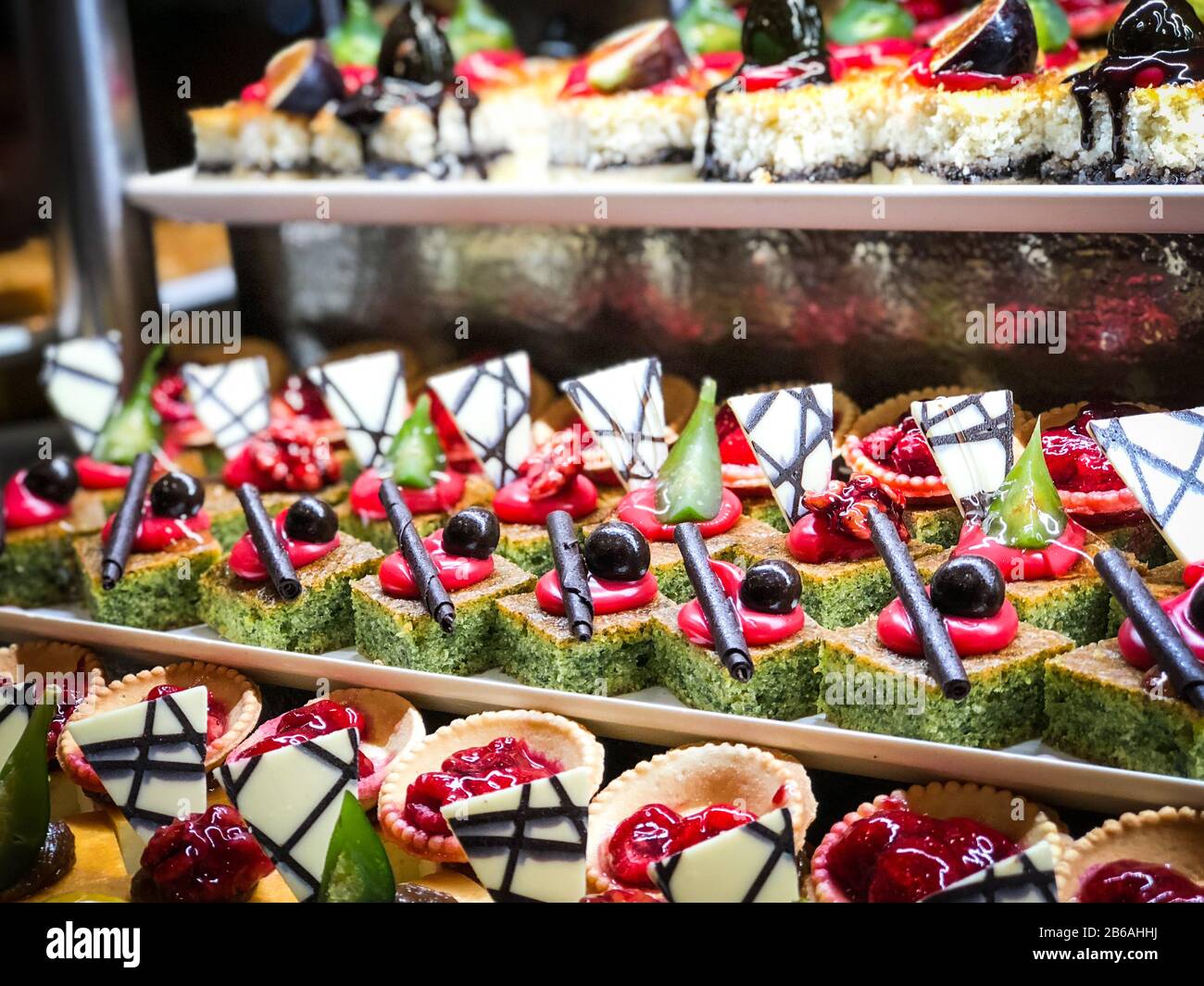 mix mini cakes & sweets with fresh fruits & glazed topping Stock Photo ...