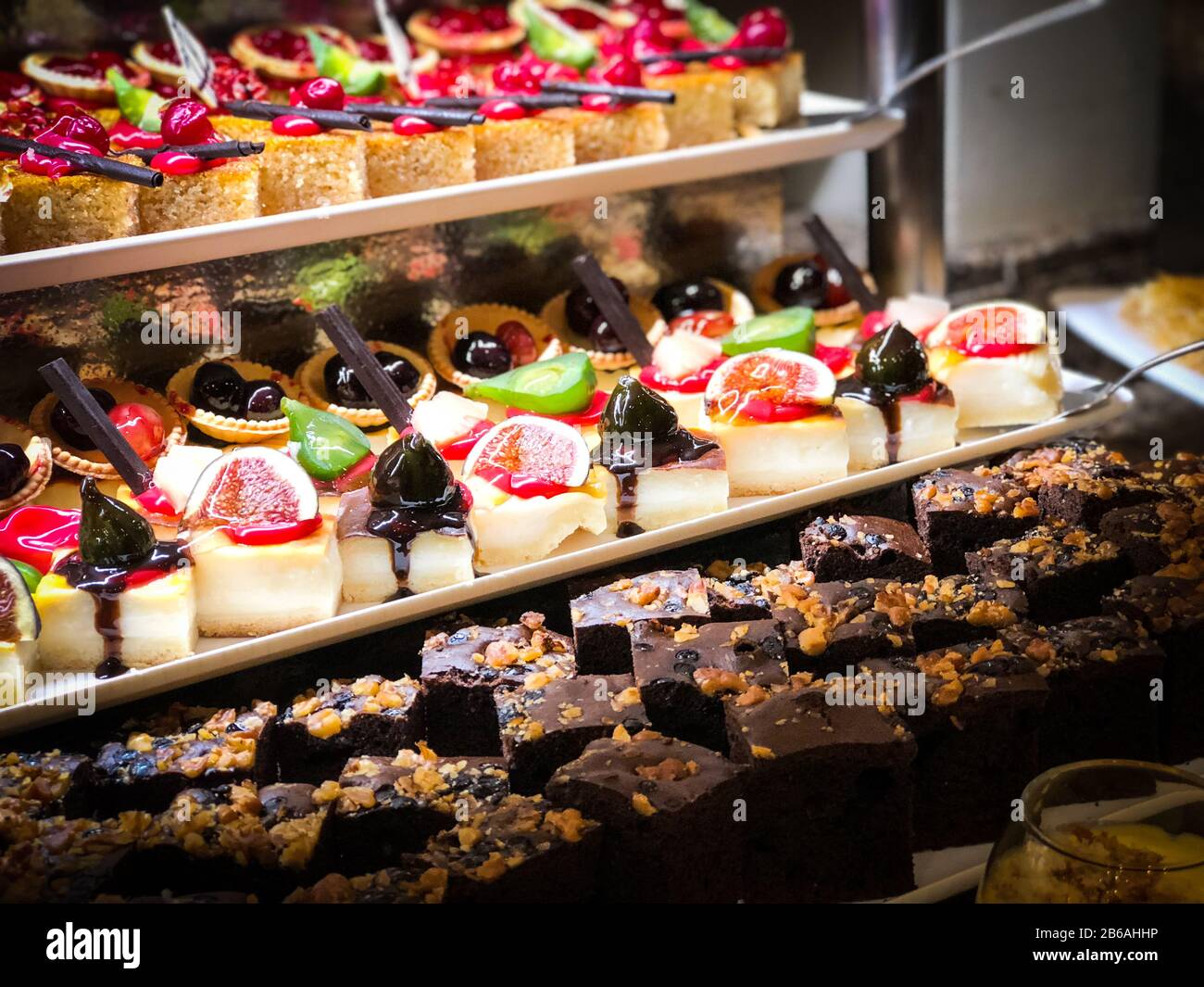 mix mini cakes & sweets with fresh fruits & glazed topping Stock Photo ...