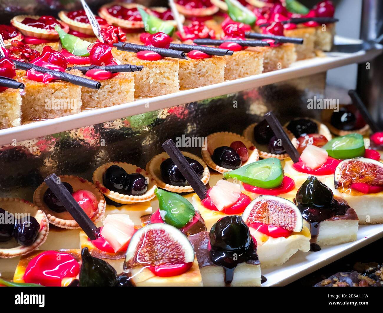 mix mini cakes & sweets with fresh fruits & glazed topping Stock Photo ...