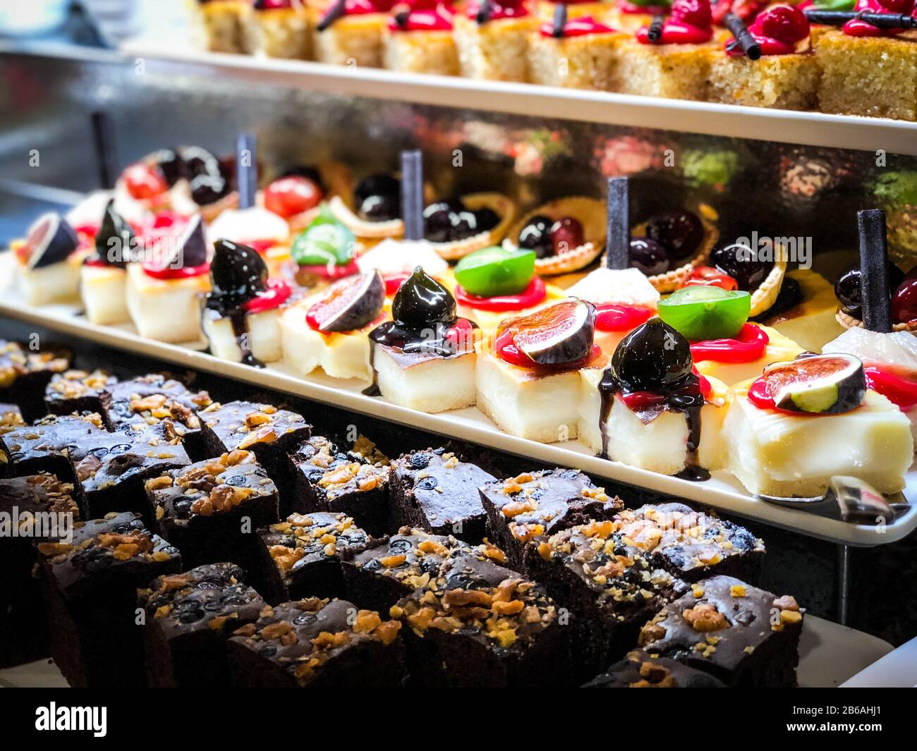 mix mini cakes & sweets with fresh fruits & glazed topping Stock Photo ...