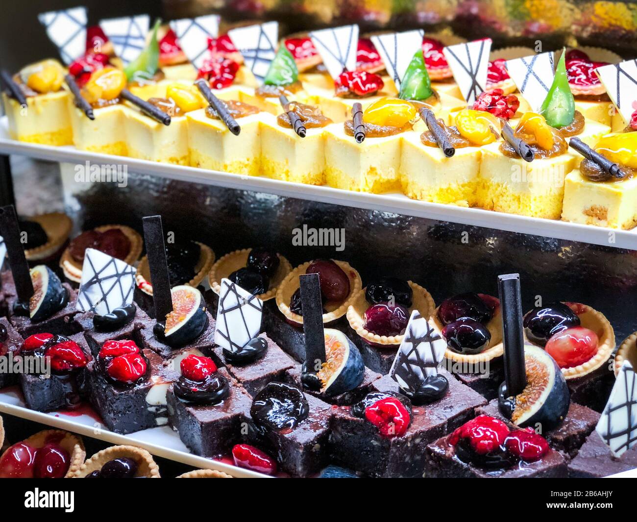 mix mini cakes & sweets with fresh fruits & glazed topping Stock Photo ...