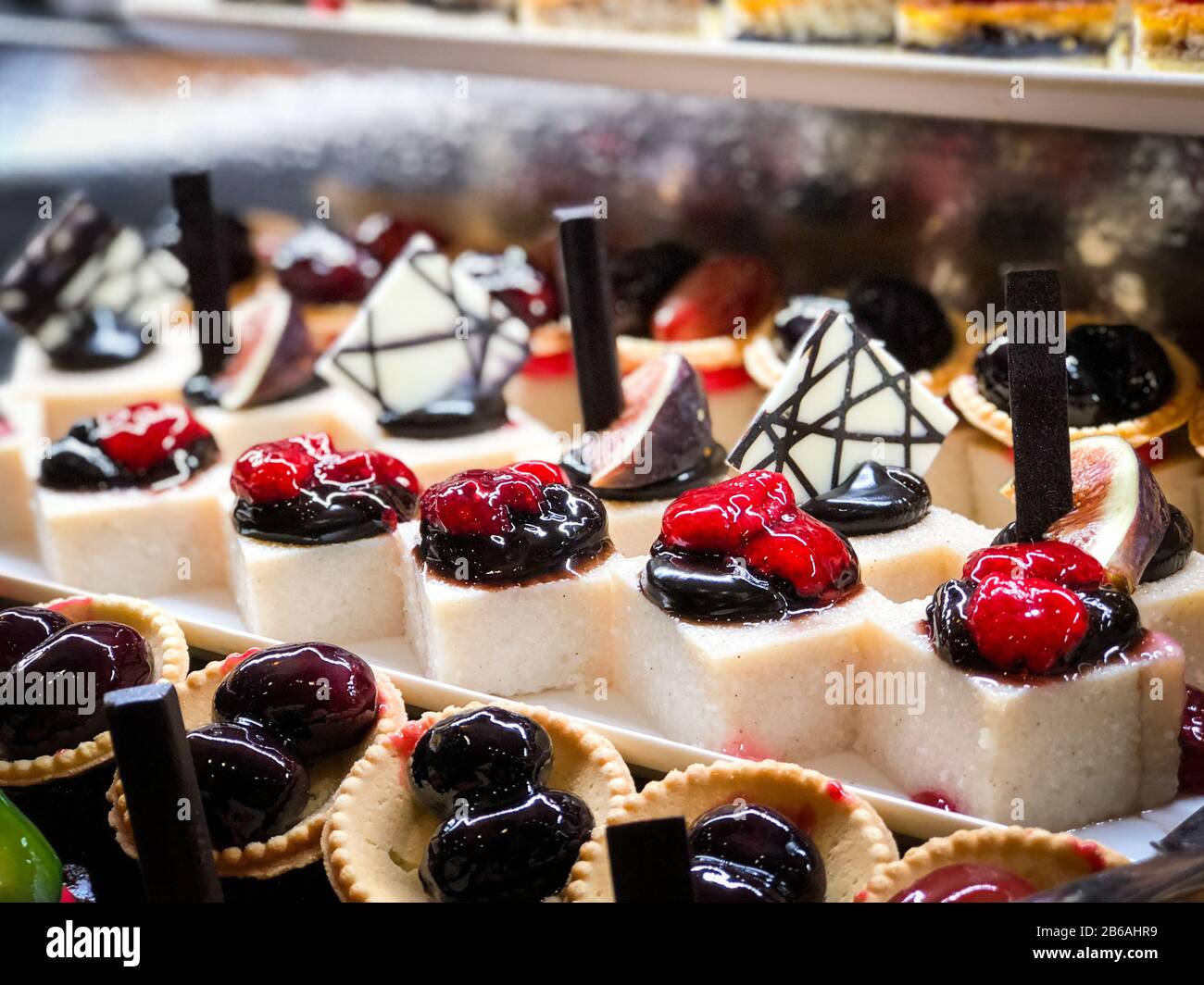 mix mini cakes & sweets with fresh fruits & glazed topping Stock Photo ...