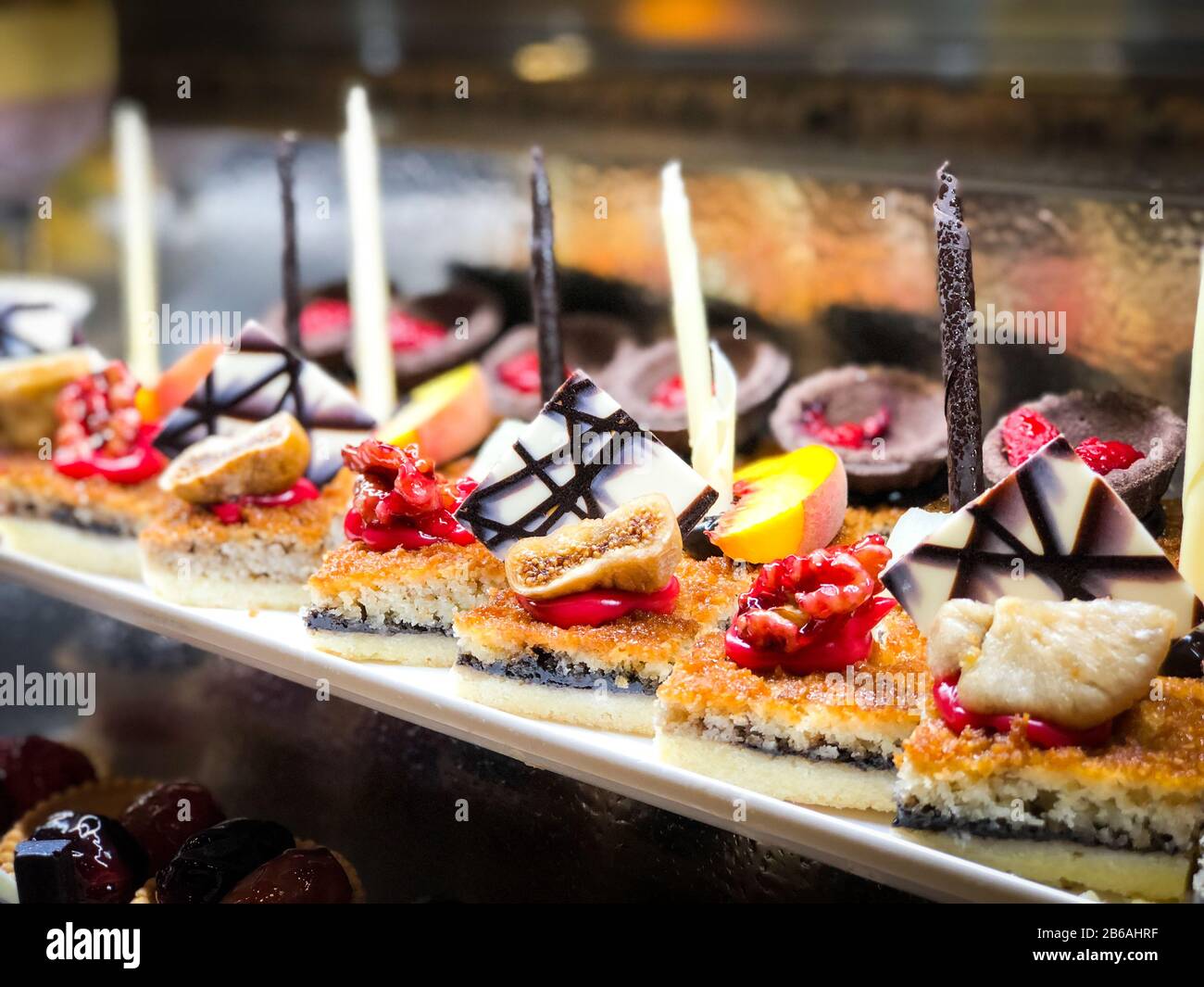 mix mini cakes & sweets with fresh fruits & glazed topping Stock Photo ...