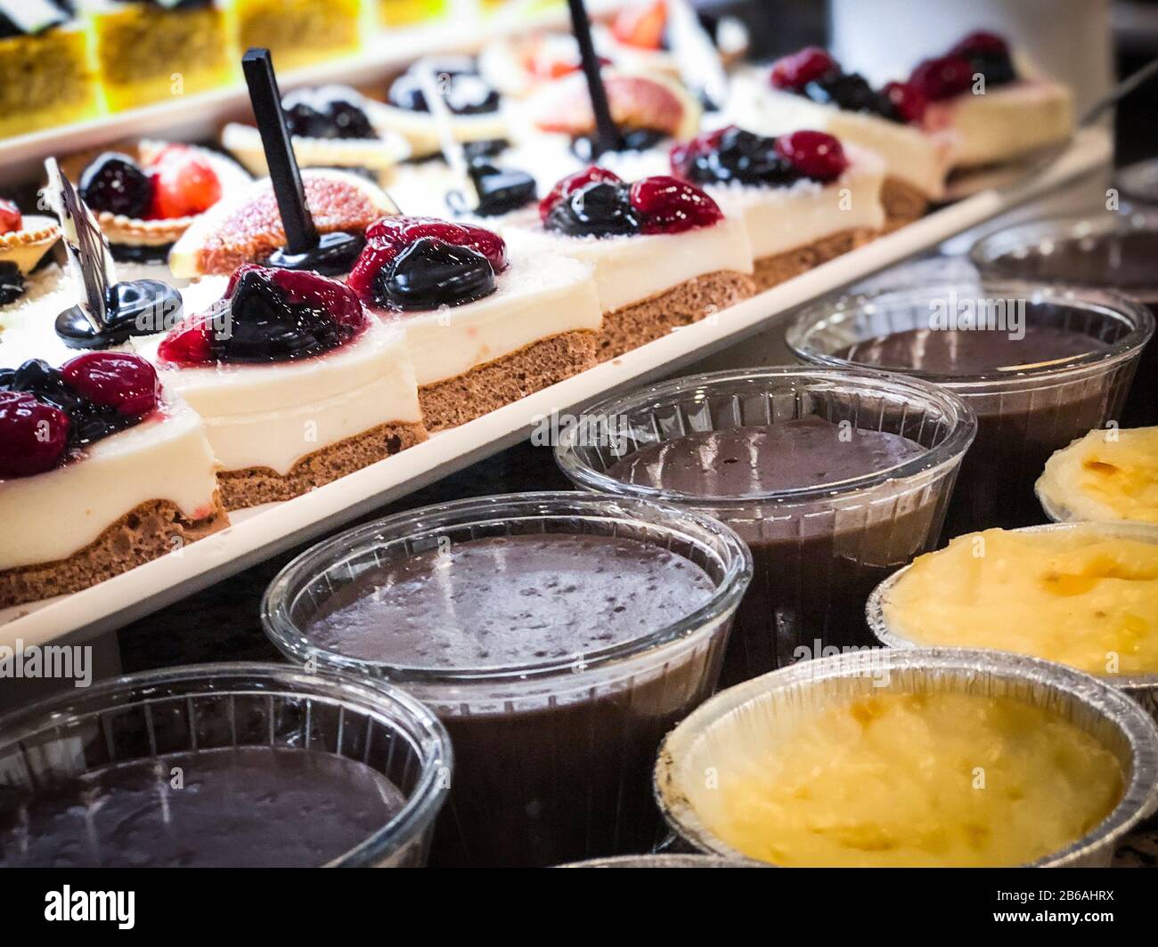 mix mini cakes & sweets with fresh fruits & glazed topping Stock Photo ...