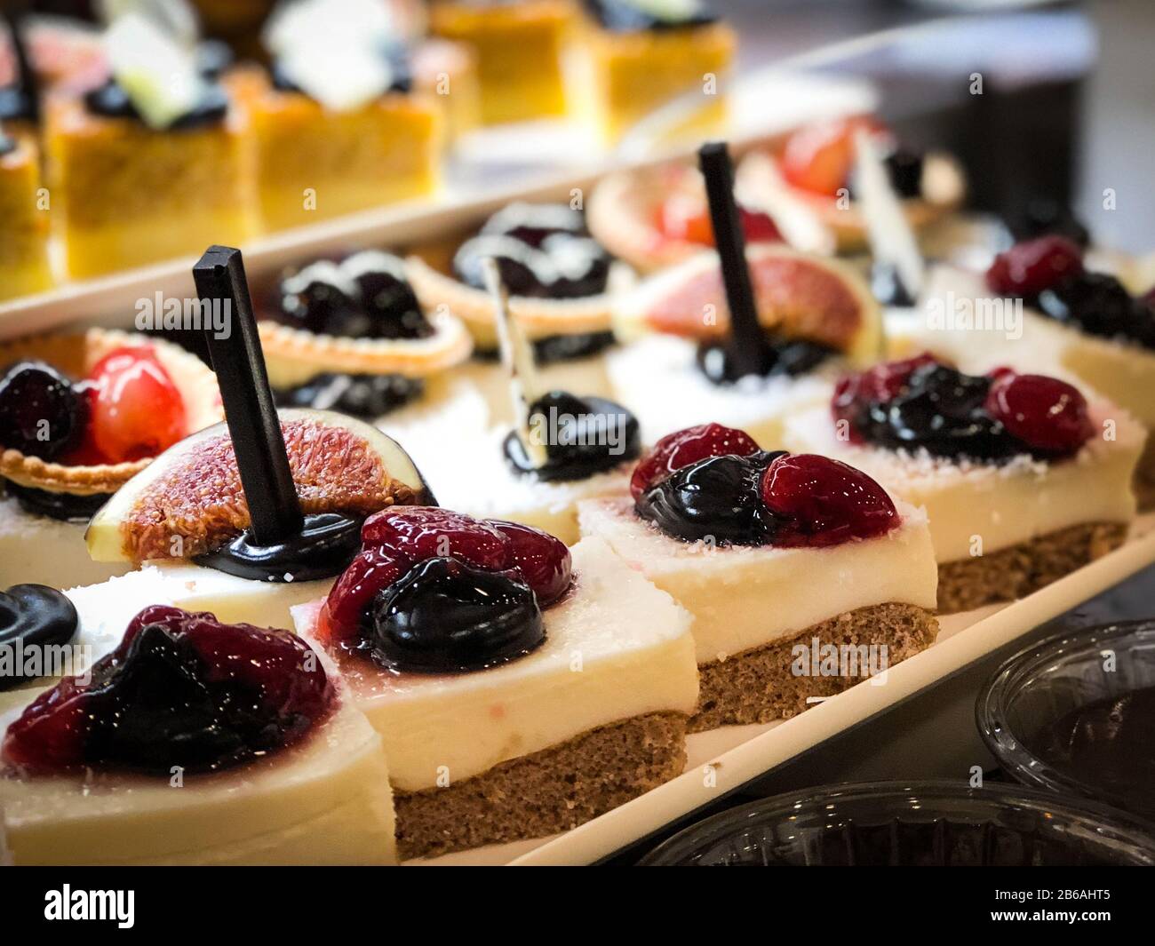 mix mini cakes & sweets with fresh fruits & glazed topping Stock Photo ...