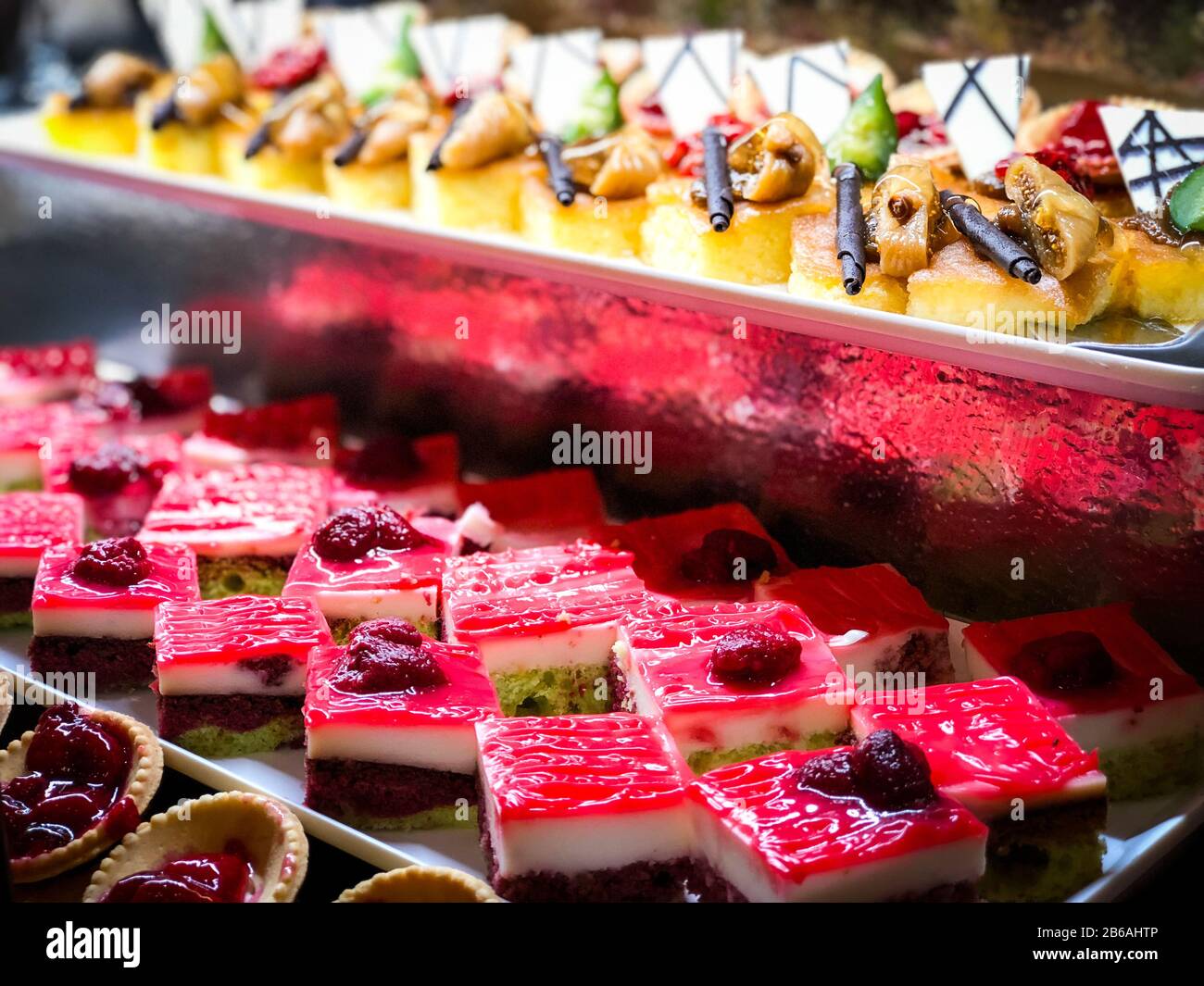 mix mini cakes & sweets with fresh fruits & glazed topping Stock Photo ...