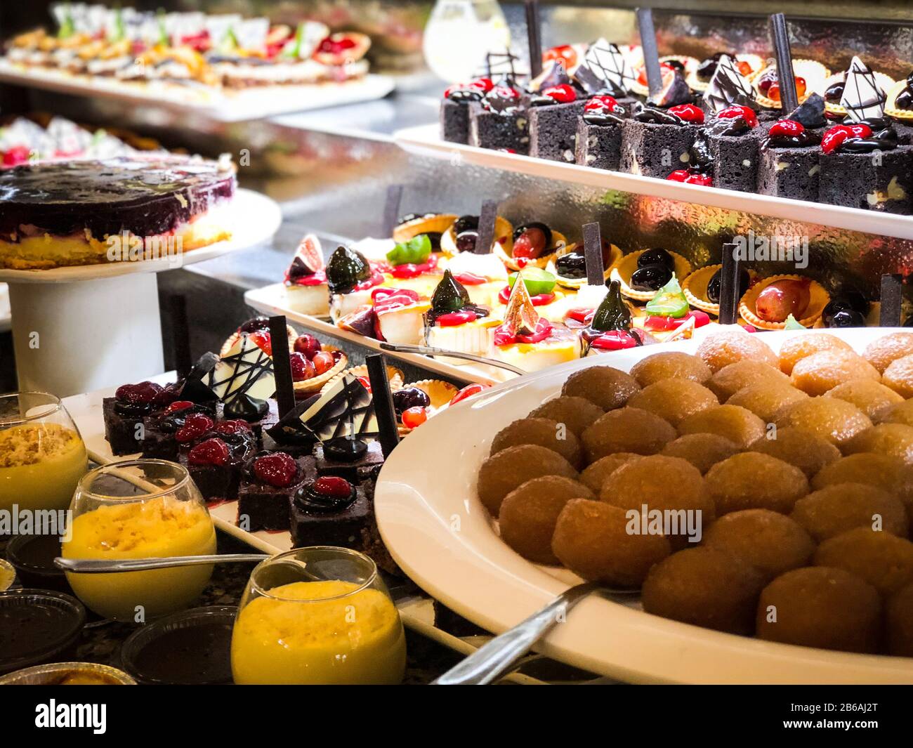 mix mini cakes & sweets with fresh fruits & glazed topping Stock Photo ...