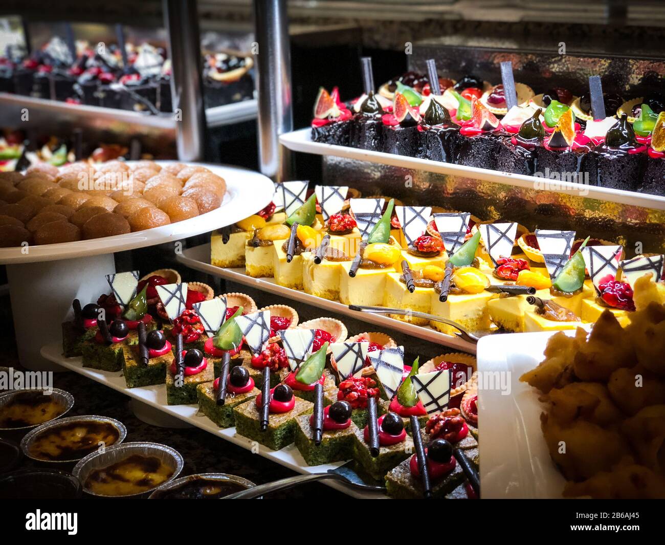 mix mini cakes & sweets with fresh fruits & glazed topping Stock Photo ...