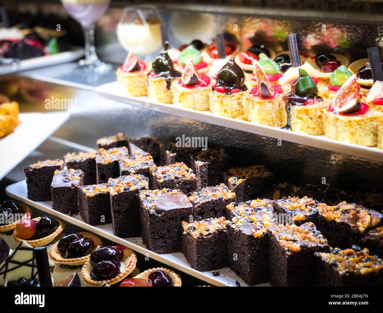 mix mini cakes & sweets with fresh fruits & glazed topping Stock Photo ...