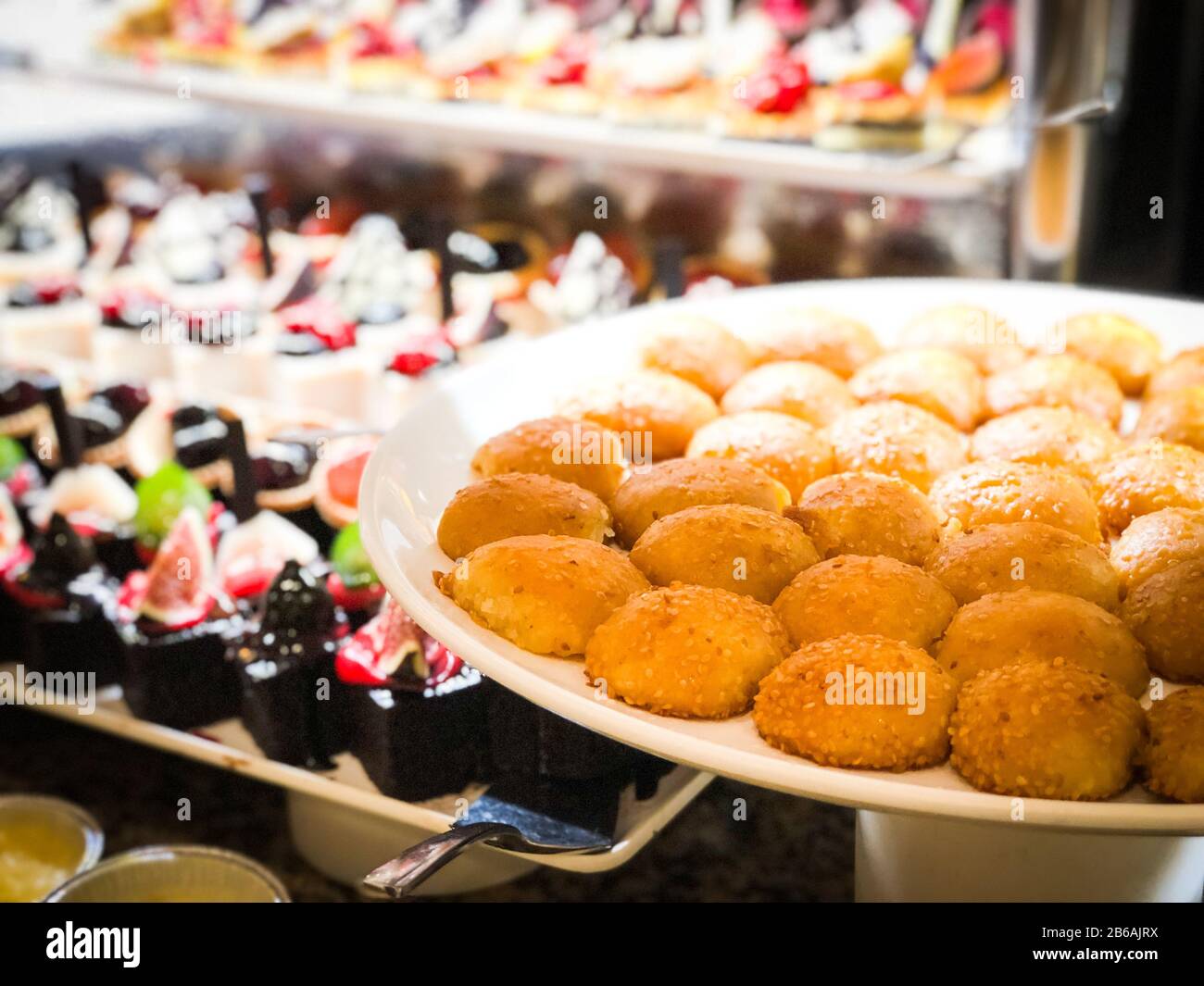 mix mini cakes & sweets with fresh fruits & glazed topping Stock Photo ...