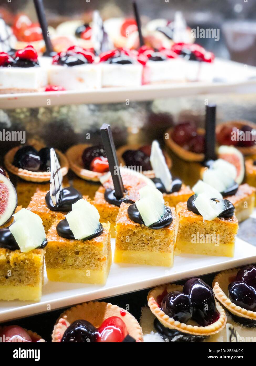 mix mini cakes & sweets with fresh fruits & glazed topping Stock Photo ...