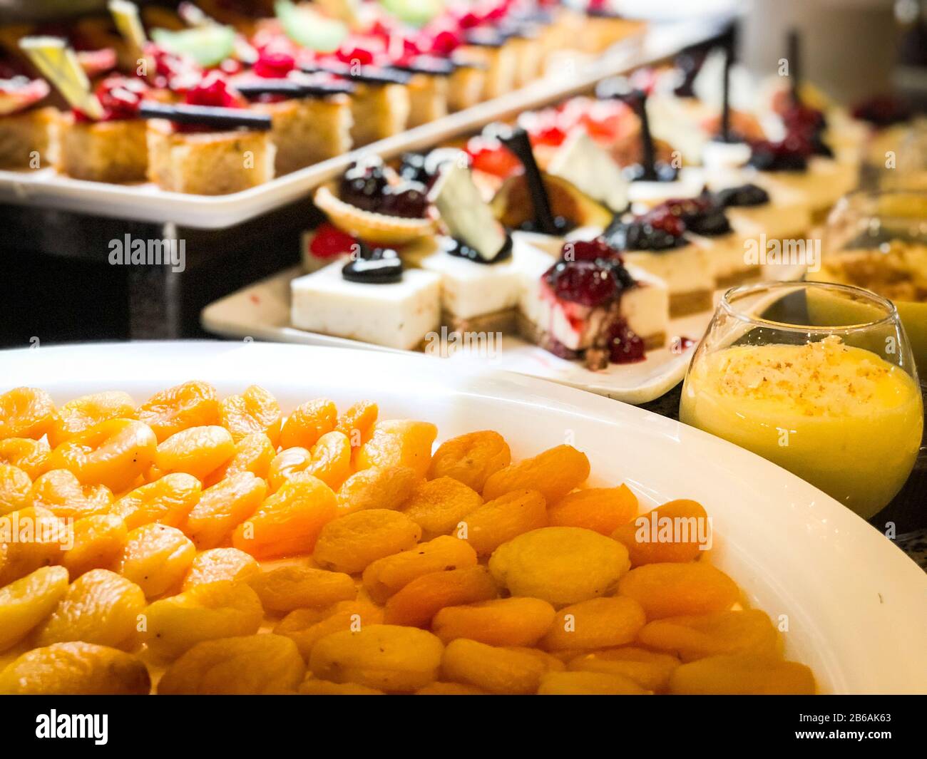 mix mini cakes & sweets with fresh fruits & glazed topping Stock Photo ...