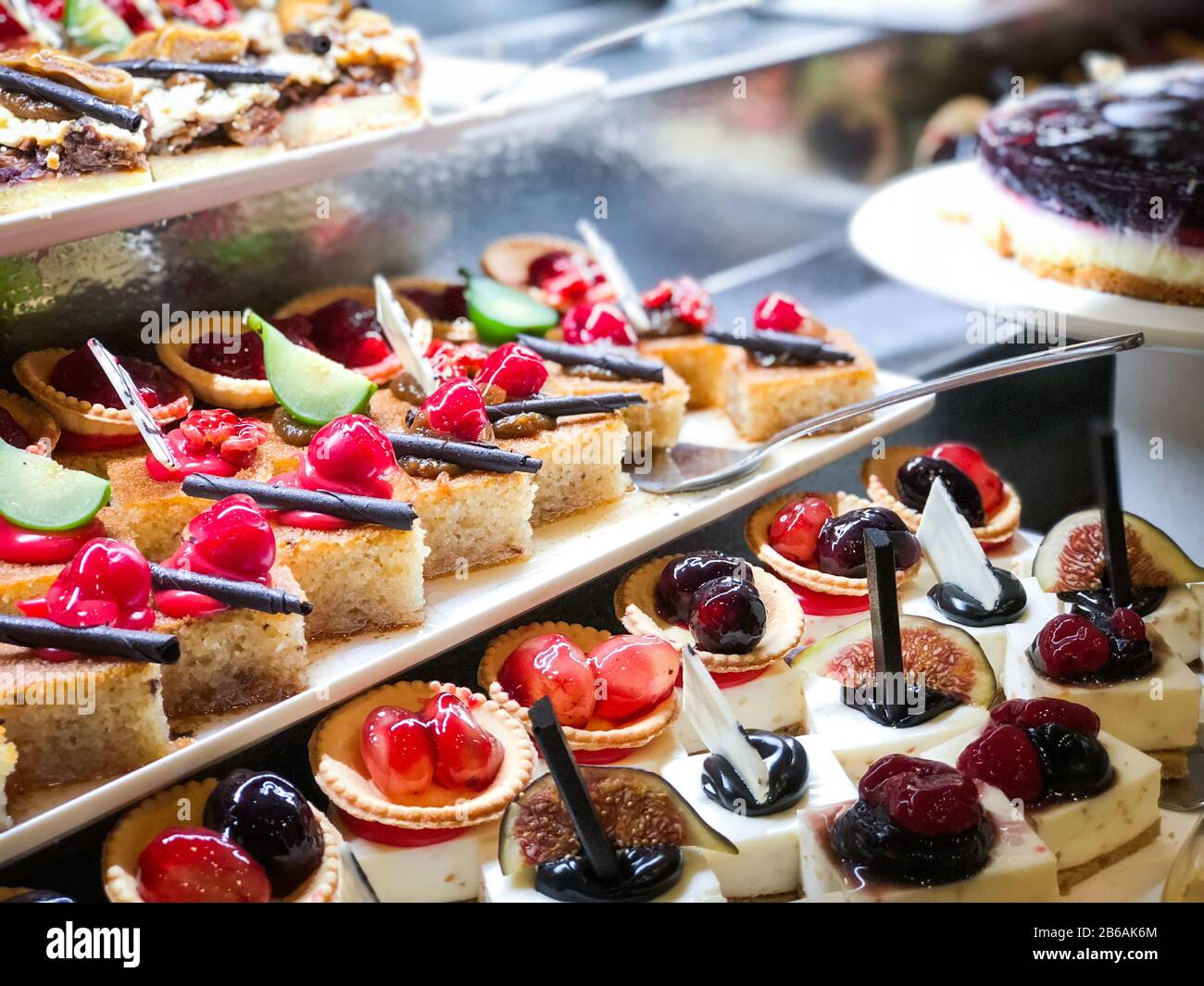 mix mini cakes & sweets with fresh fruits & glazed topping Stock Photo ...