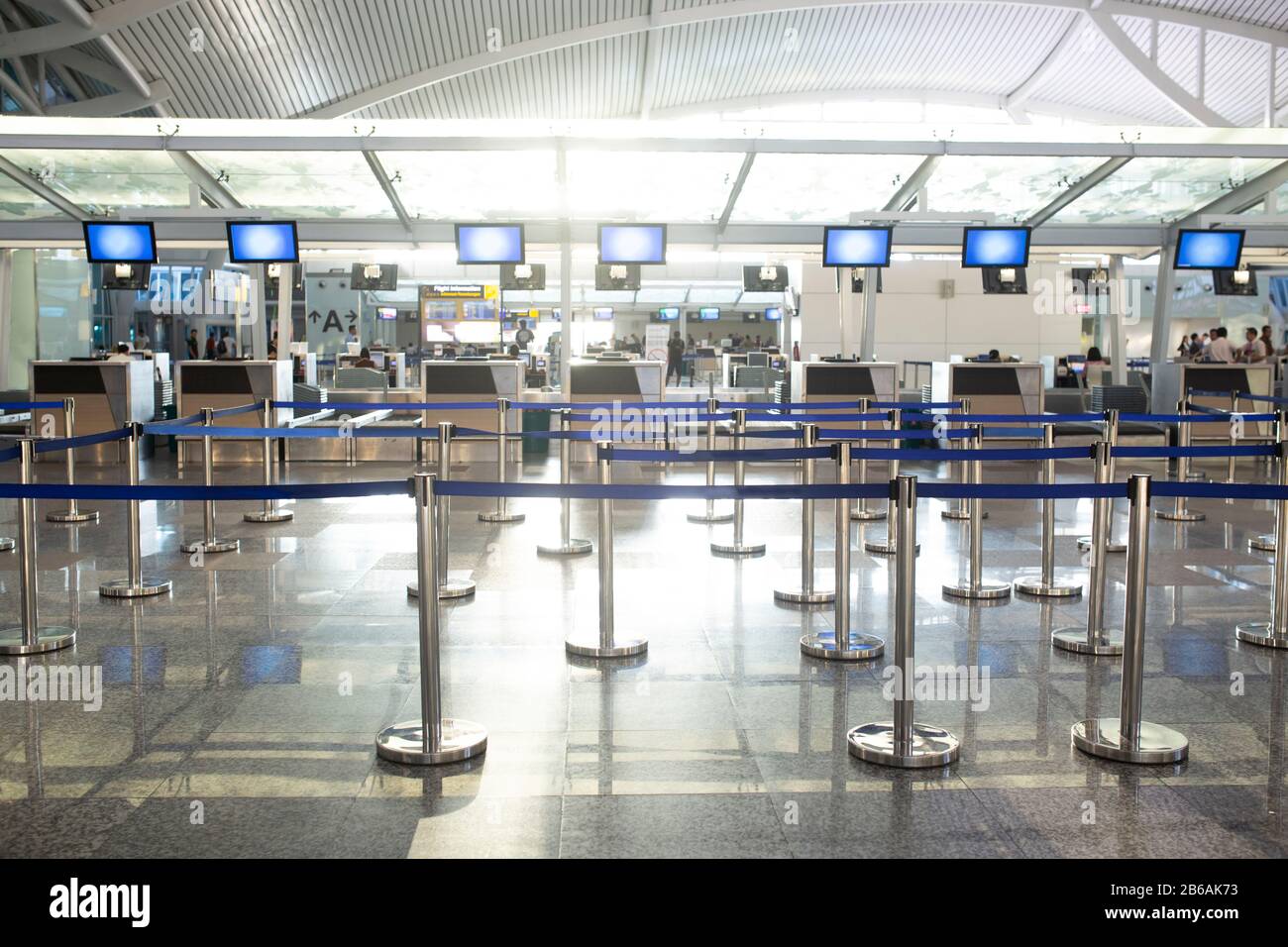 Empty check-in desks at the airport terminal Stock Photo - Alamy