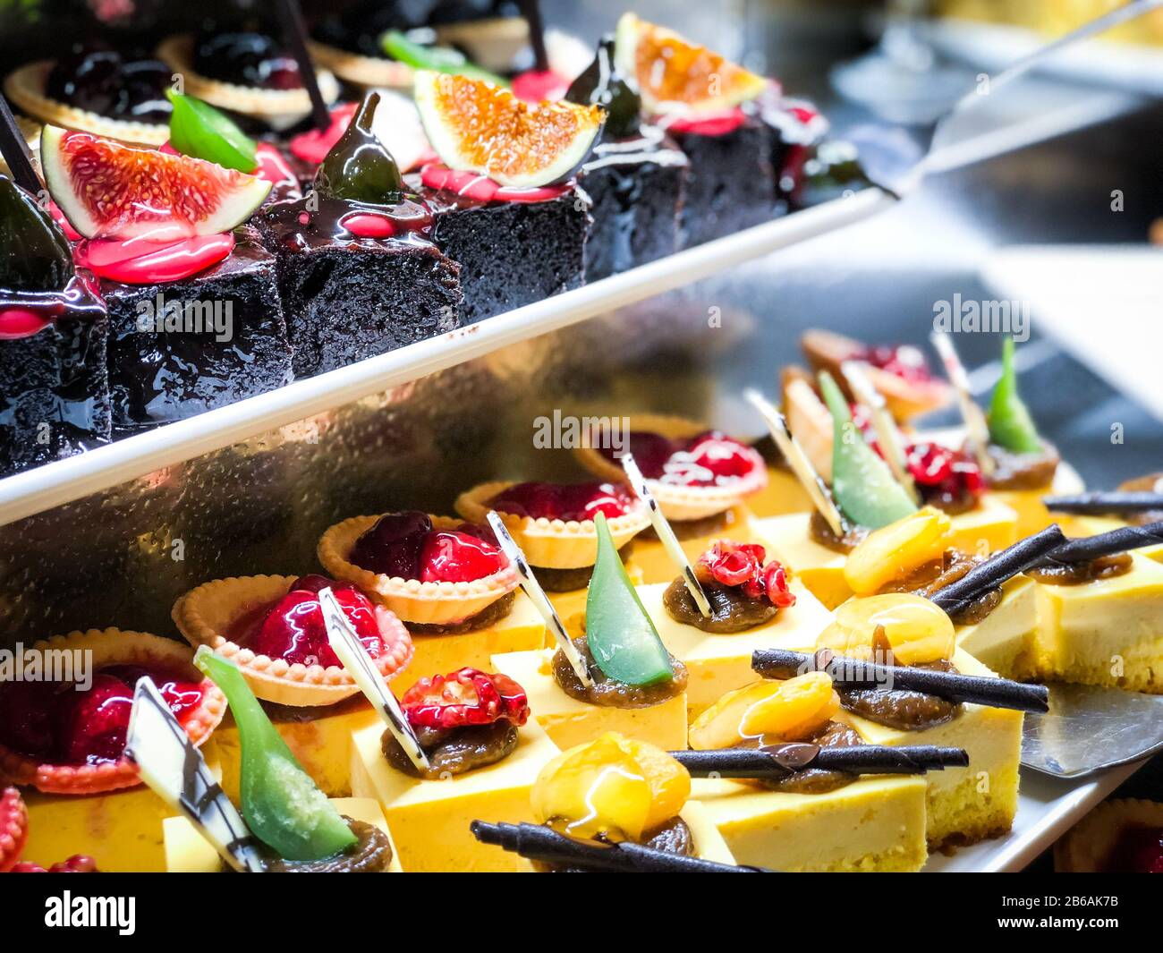 mix mini cakes & sweets with fresh fruits & glazed topping Stock Photo ...