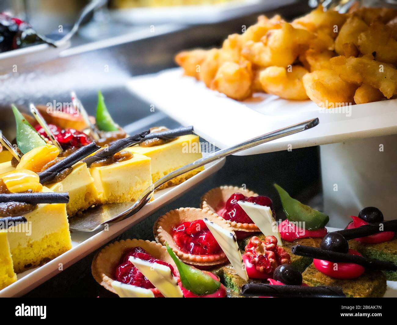 mix mini cakes & sweets with fresh fruits & glazed topping Stock Photo ...