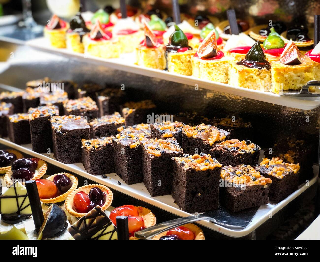 mix mini cakes & sweets with fresh fruits & glazed topping Stock Photo ...