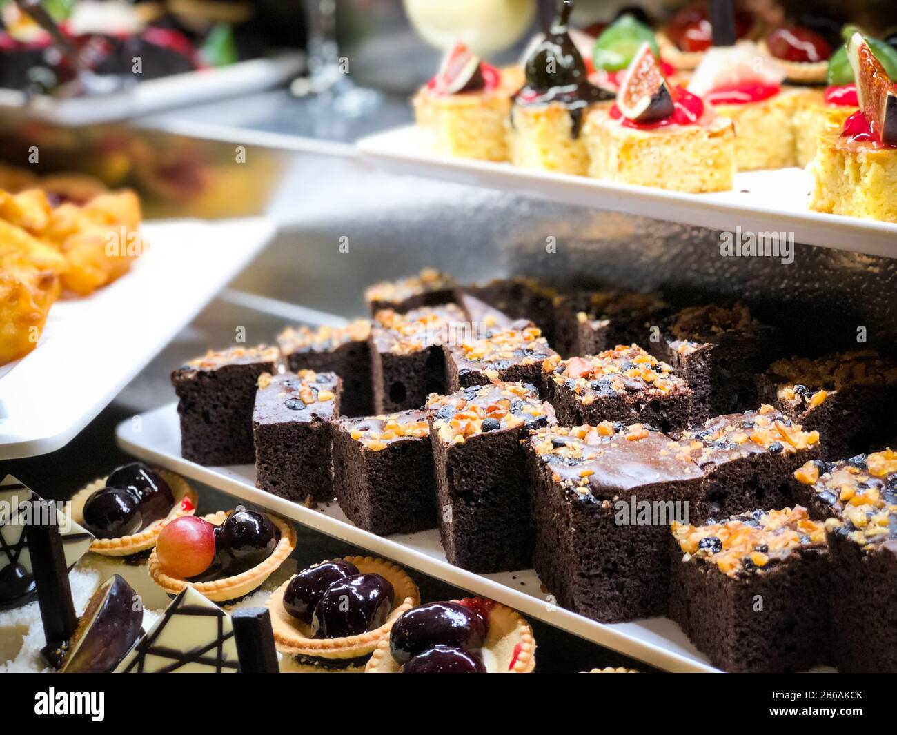 mix mini cakes & sweets with fresh fruits & glazed topping Stock Photo ...