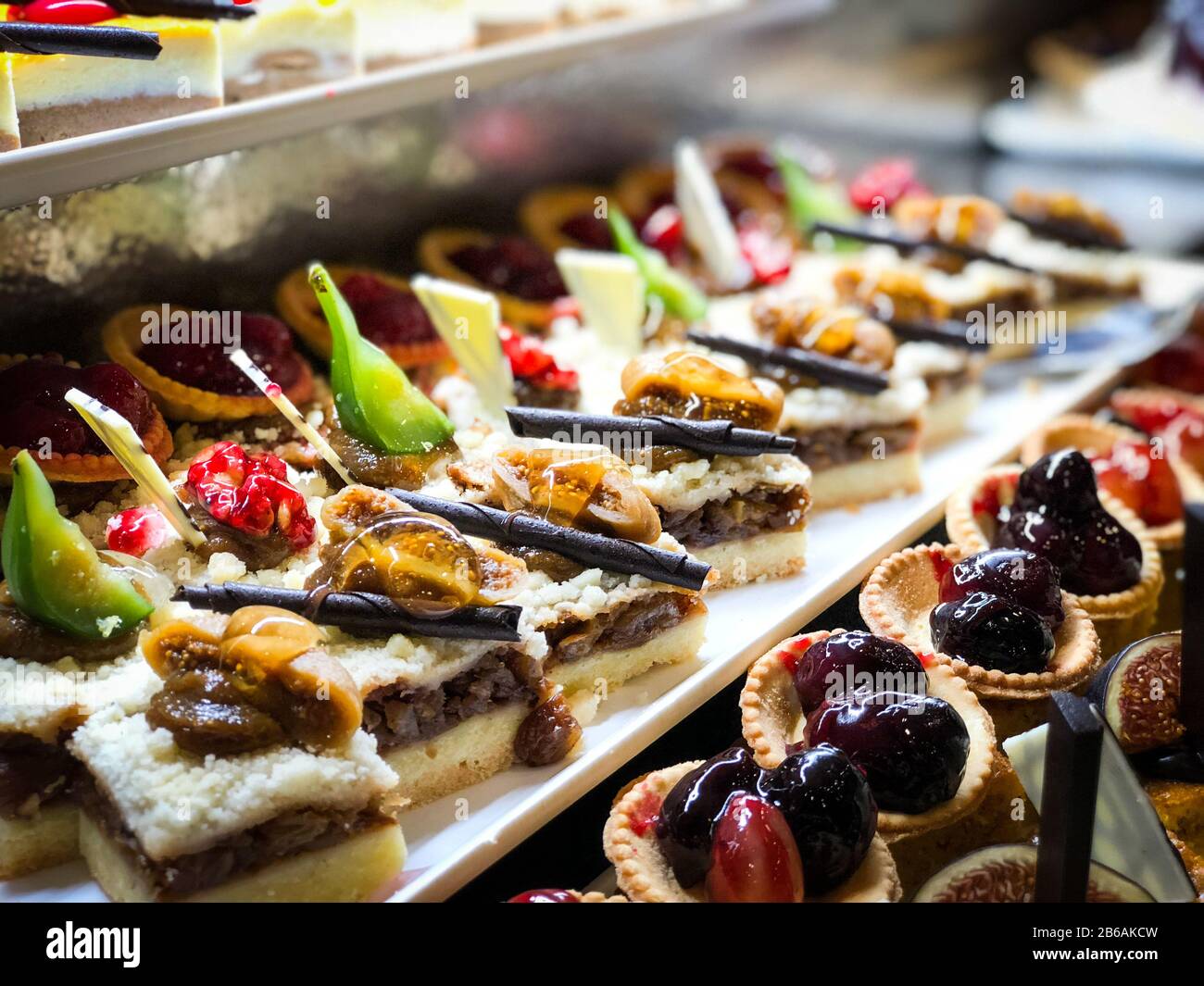 mix mini cakes & sweets with fresh fruits & glazed topping Stock Photo ...
