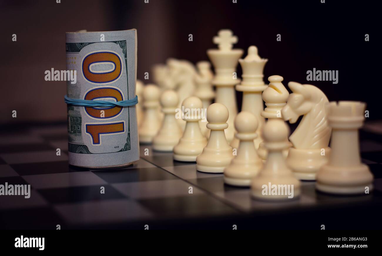 Dollars on the background of chess pieces. Profit strategy. Good luck ...