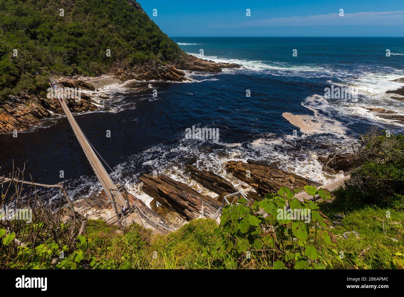 A wide view looking down on Storms River Mouth where the river meets ...