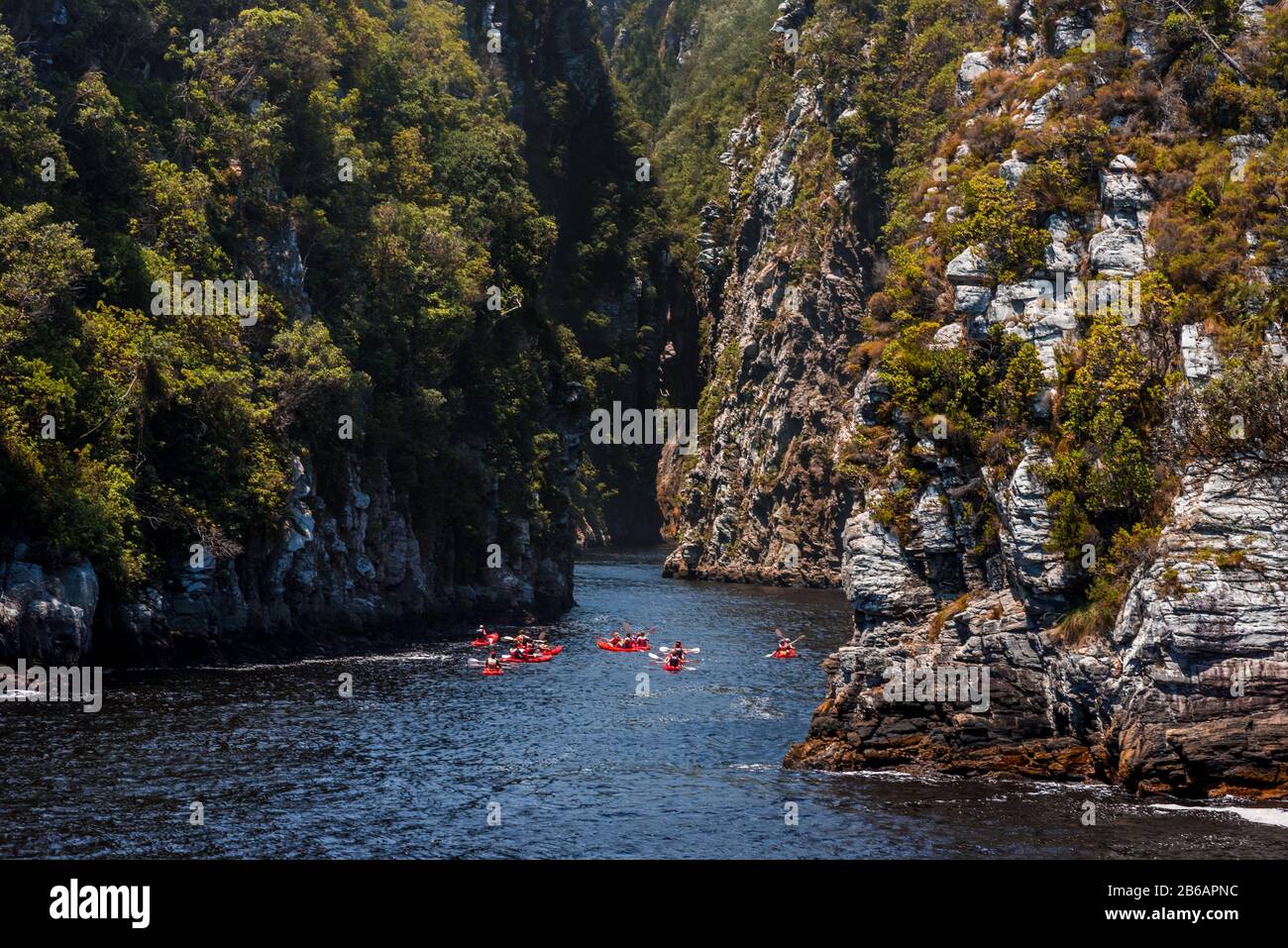 A group of kayakers setting out into the Storms River gorge at Storms ...