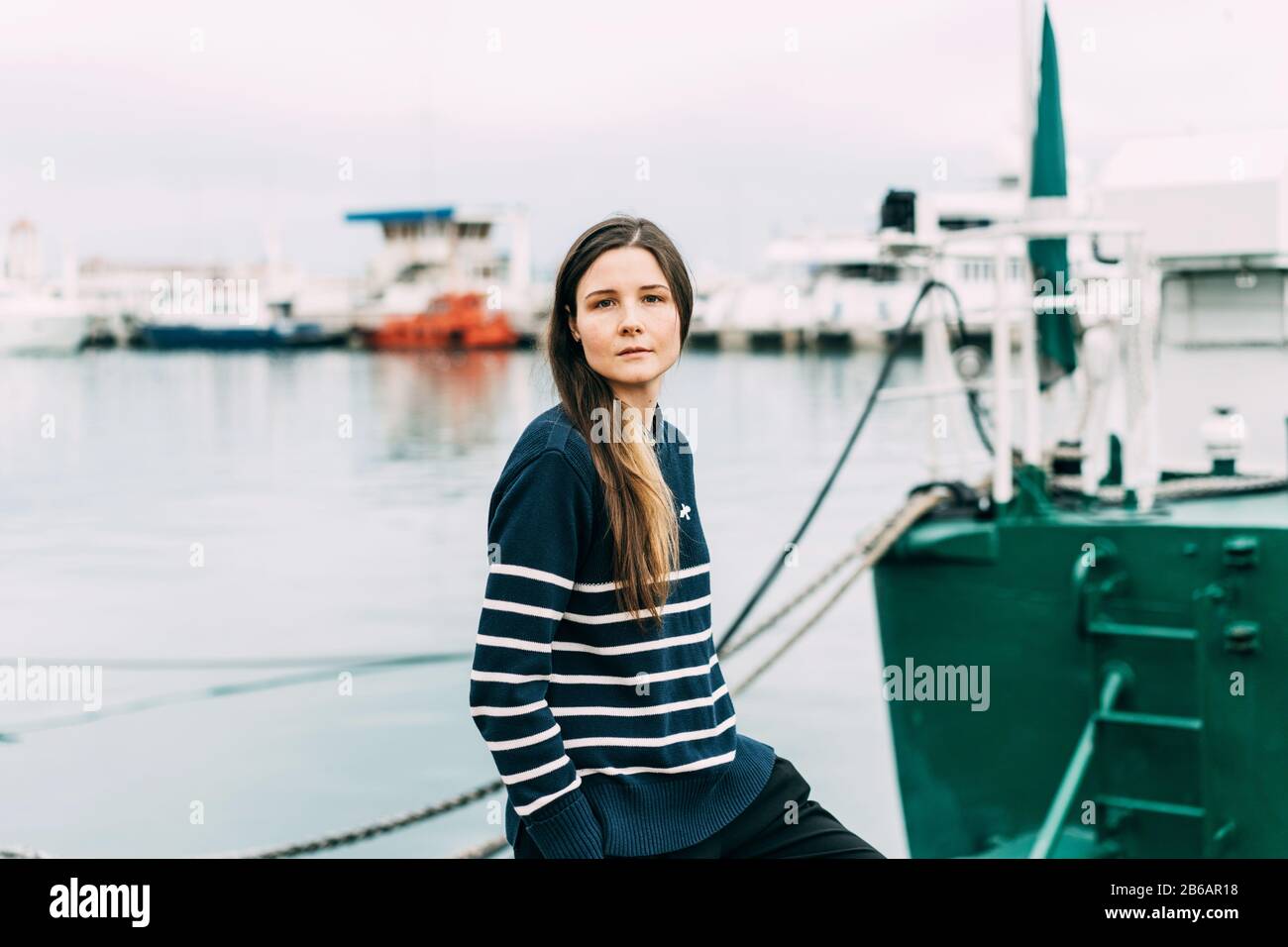 woman serious portrait brunette seaport Stock Photo - Alamy