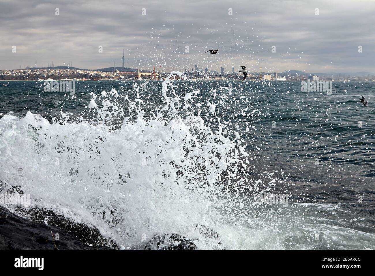 Surf in the Golden Horn Bay, waves crash on the coastal cliffs in the ...