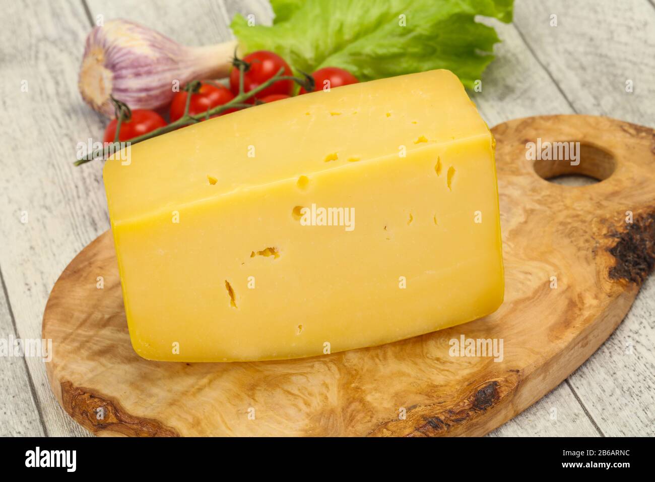 Swiss Hard yellow tasty cheese brick Stock Photo - Alamy