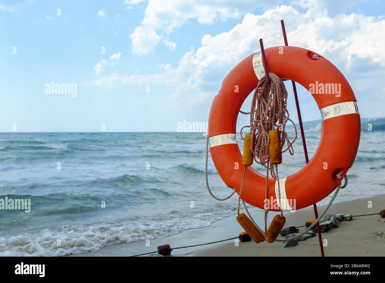 Life preserver on sandy beach somewhere in Black Sea Stock Photo - Alamy