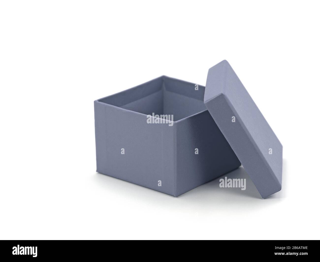 Gray empty cardboard box in front of white background Stock Photo - Alamy