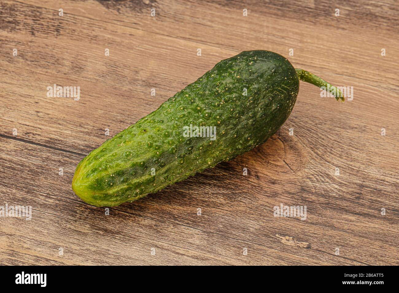 Green ripe fresh one cucumber over background Stock Photo - Alamy