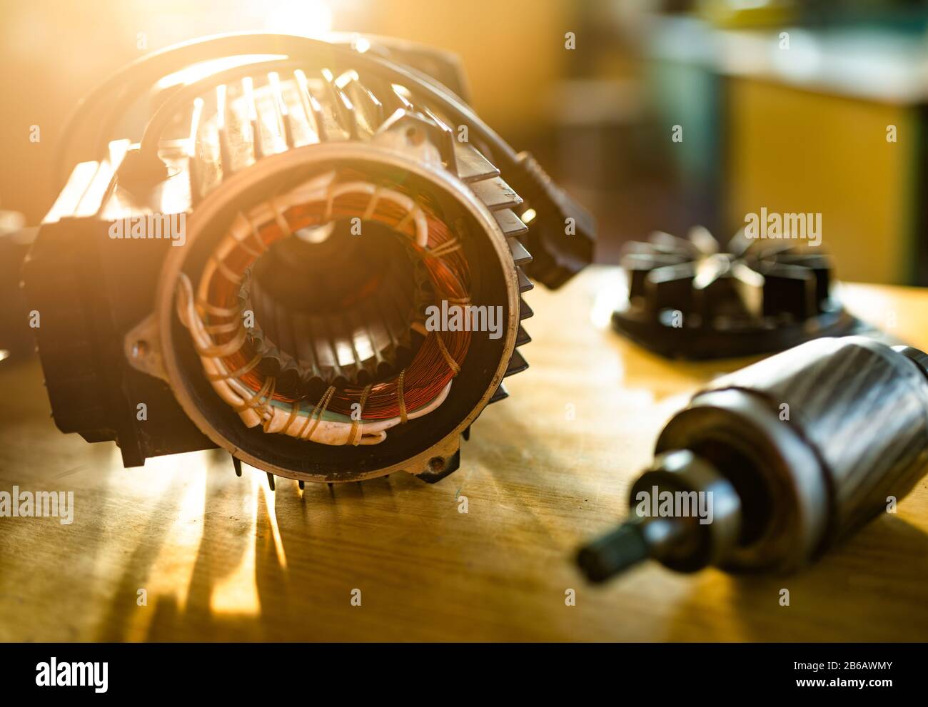 Close-up of an iron industrial motor lies on a table during the ...