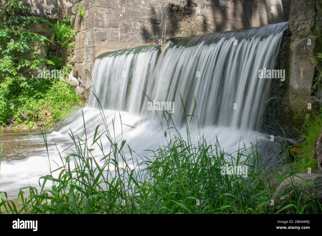Long exposure of floodgate canal lock waterfall Stock Photo - Alamy