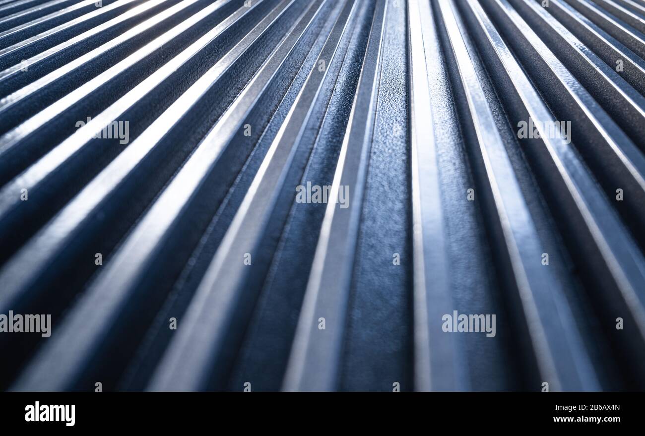 Close-up of a golden corrugated metal surface of unidentified equipment ...