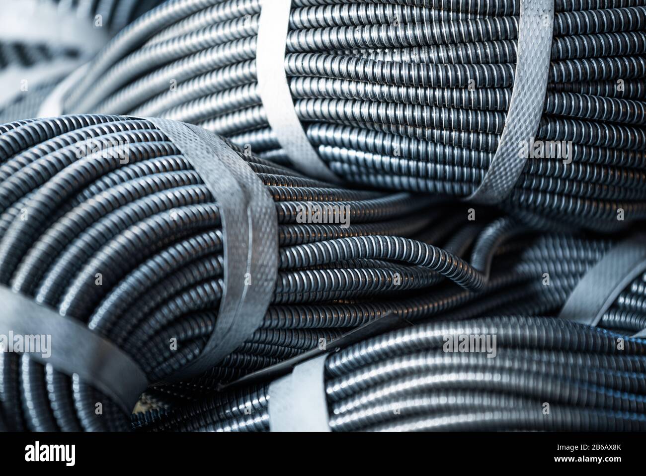 Close-up of a huge bundle of metal flexible tubes interconnected in a ...