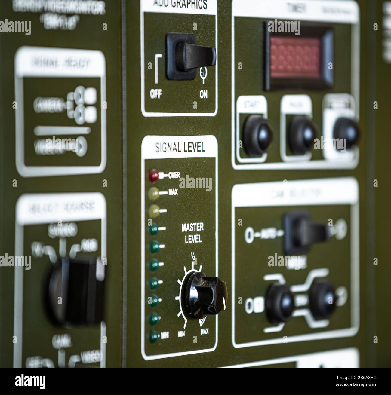 Close-up side view of a panel of buttons and twirls located on a panel ...