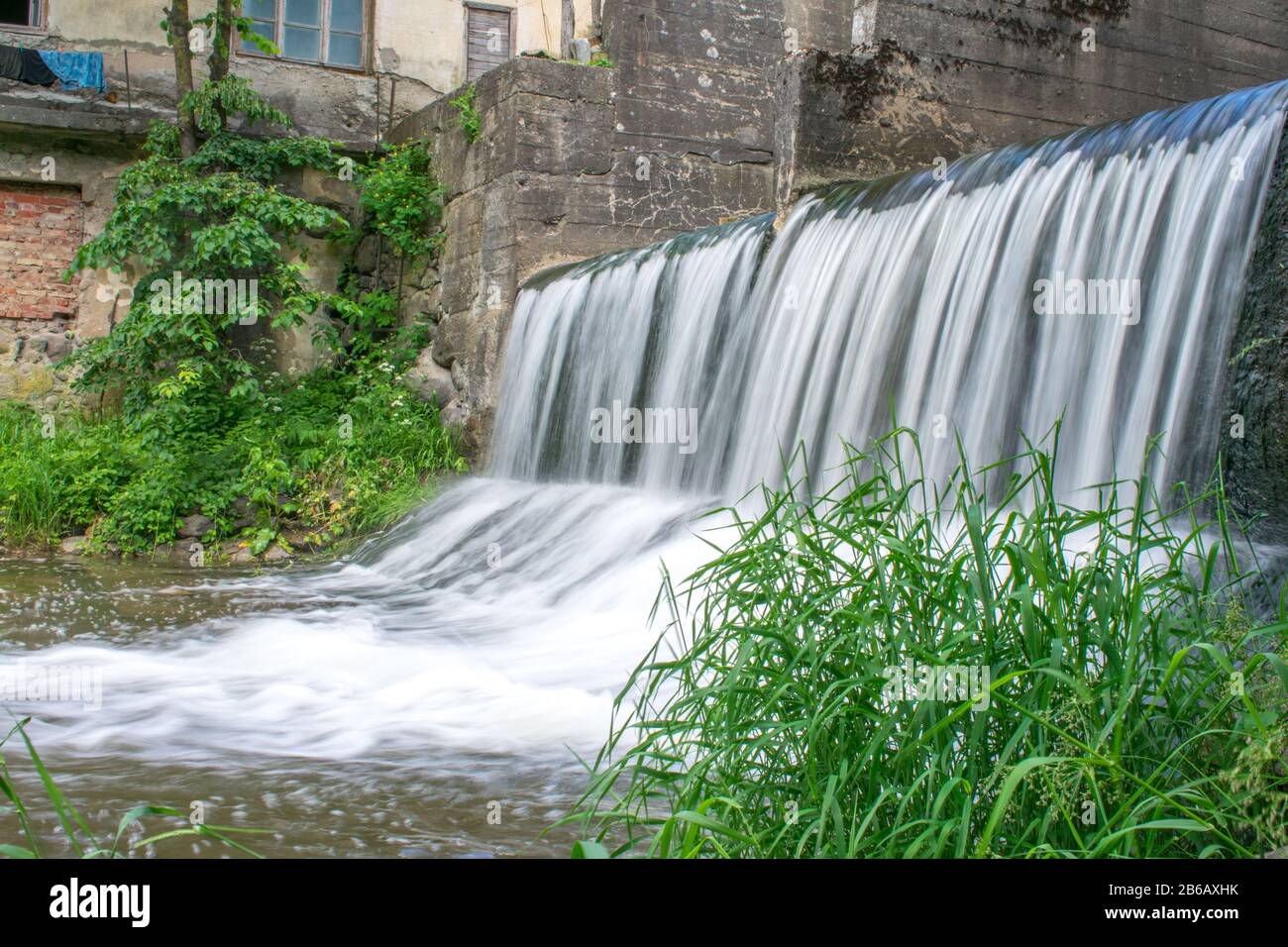 Long exposure of floodgate canal lock waterfall Stock Photo - Alamy