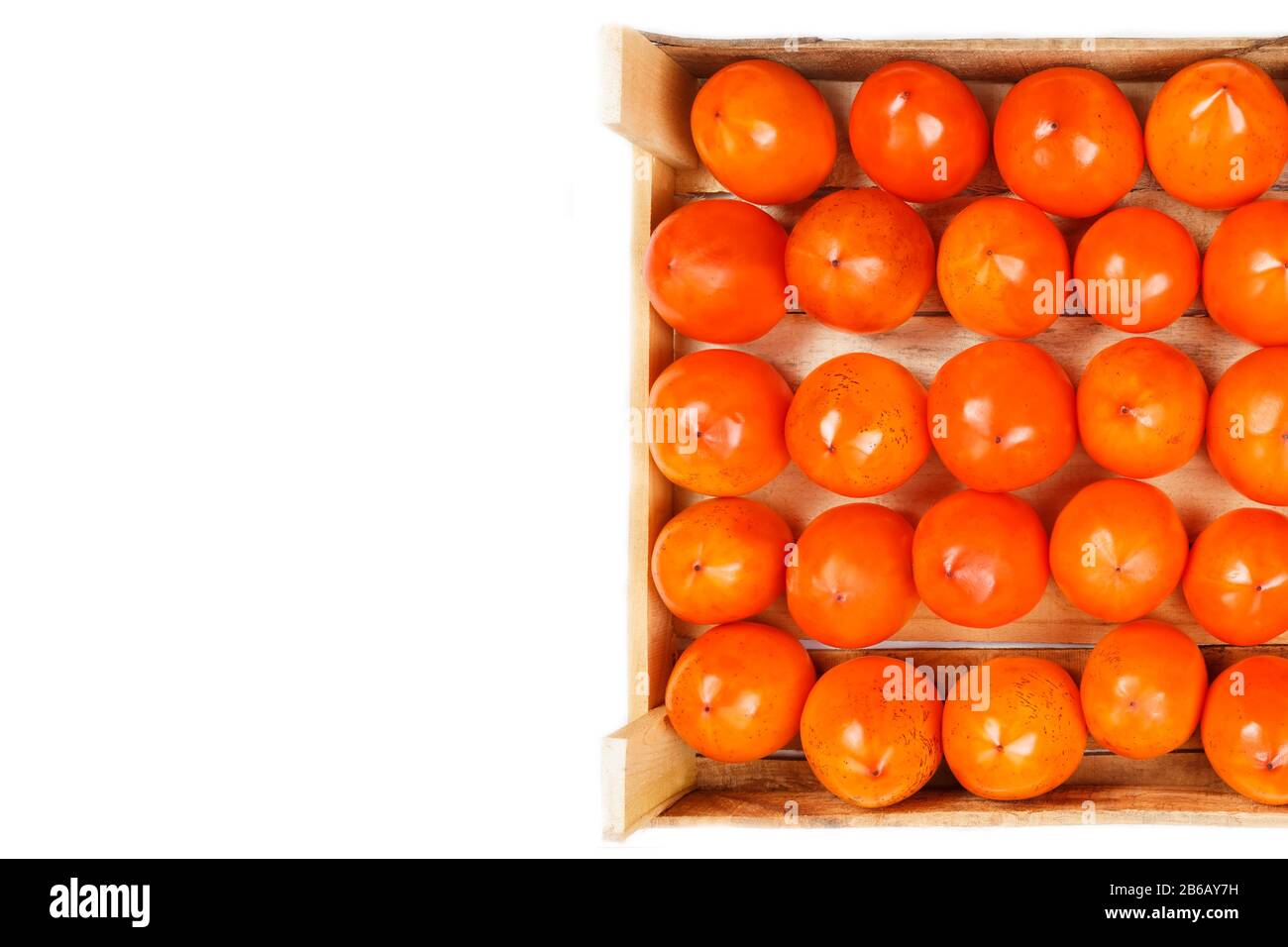 Persimmon fruit in the wooden box isolated on white. Clipping Path ...