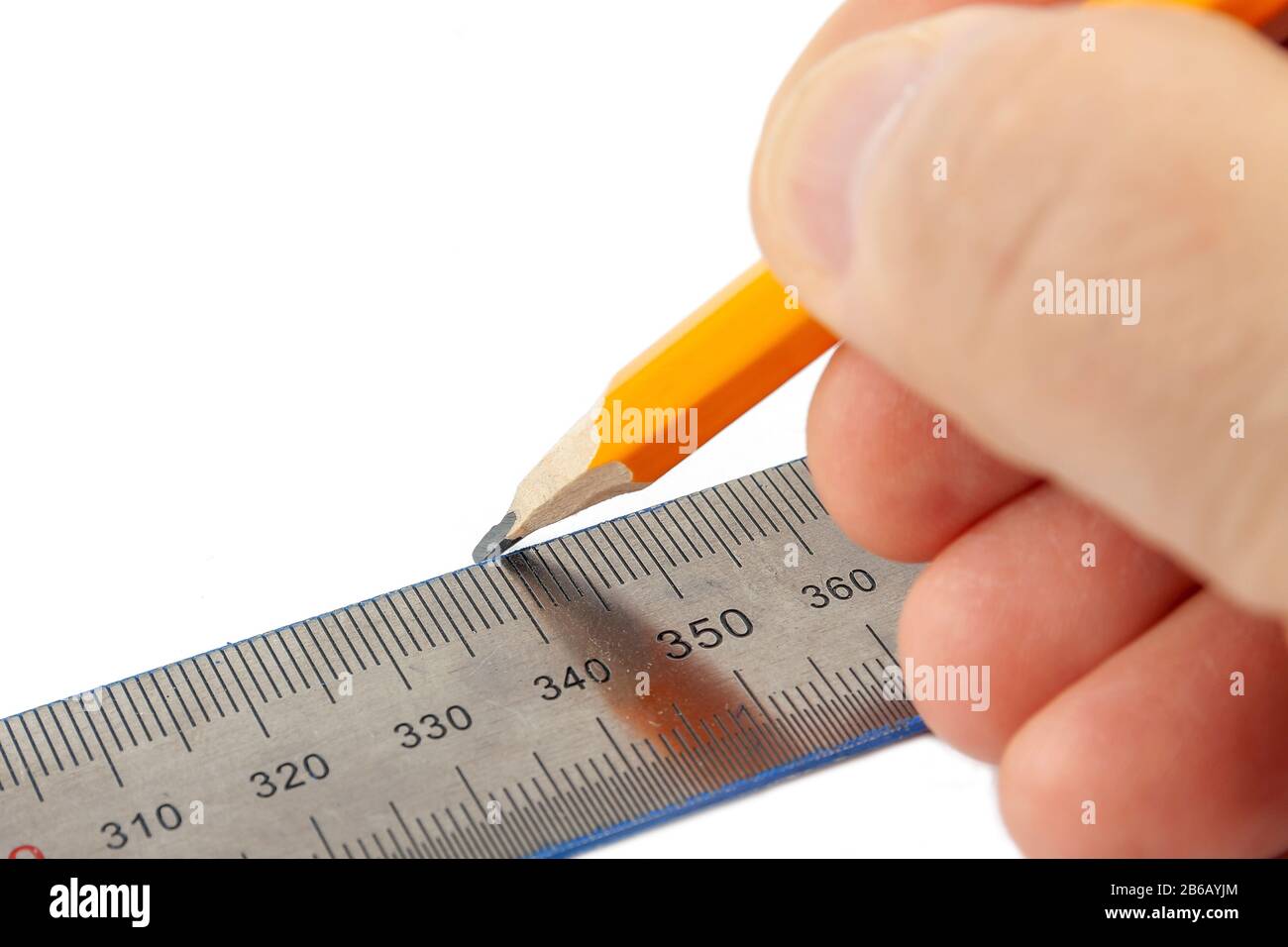 Pencil draw a straight line with the help of a ruler Stock Photo - Alamy