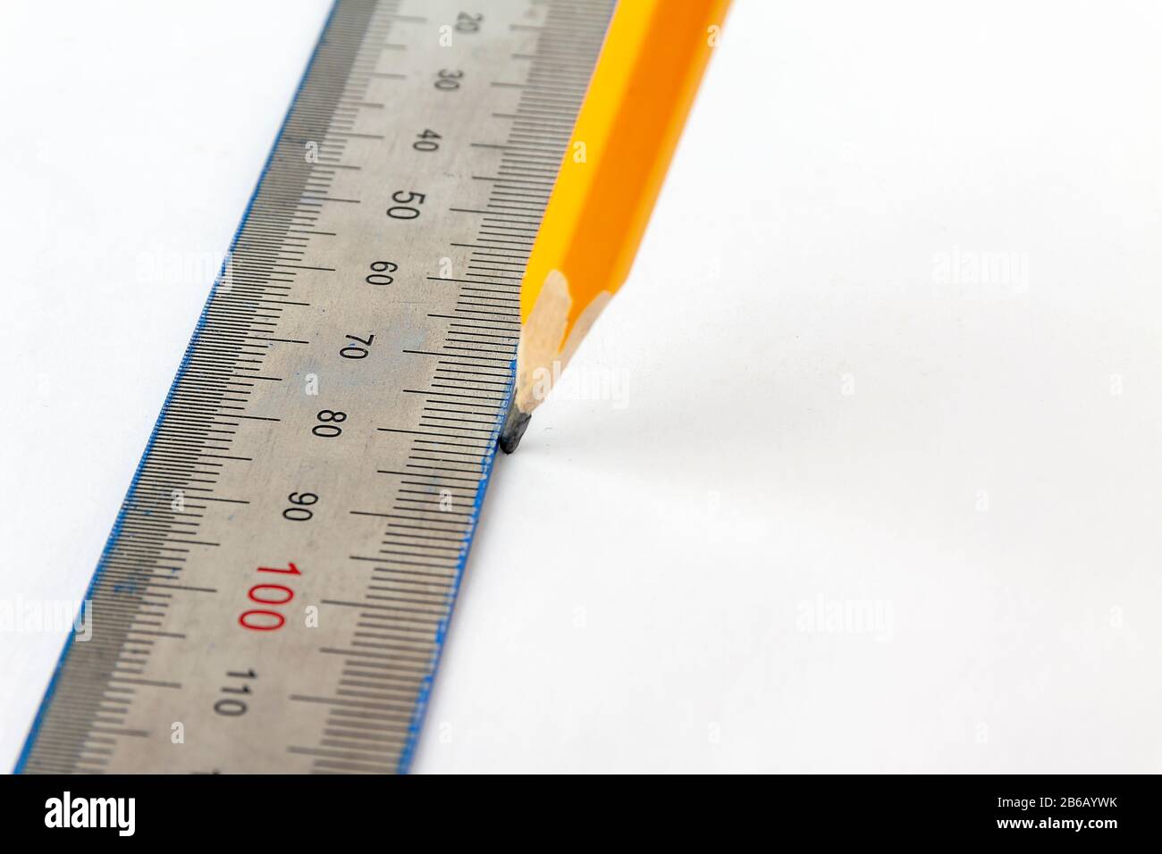 Pencil draw a straight line with the help of a ruler Stock Photo - Alamy