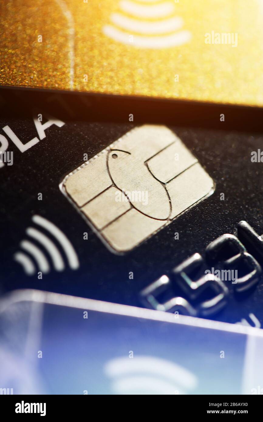 Macro low key with credit card. Selective focus microchip on paying by ...