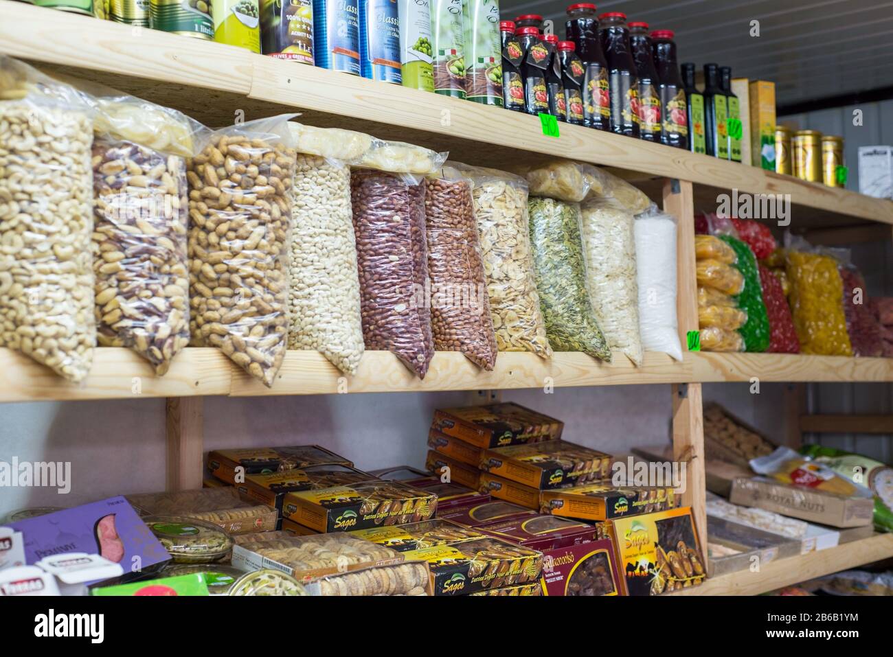 Sweet dried fruits and nuts on store counter general plan of the store ...