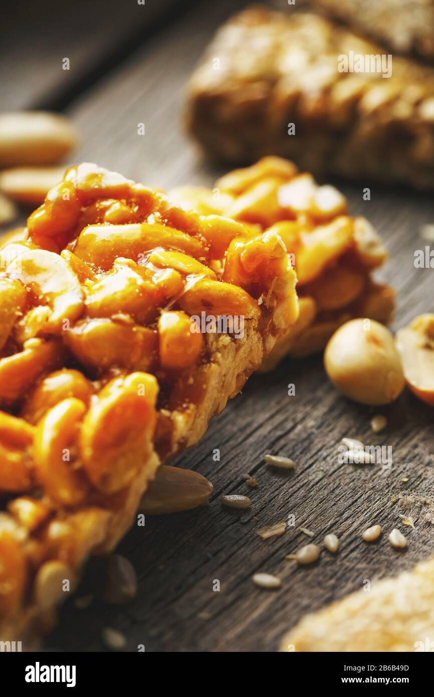 Sweets bar of peanuts on a vintage background with burlap. Delicious ...