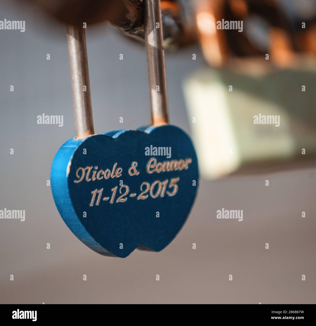 Closeup of a padlock hanging on chain link of the bridge / Fence Stock ...