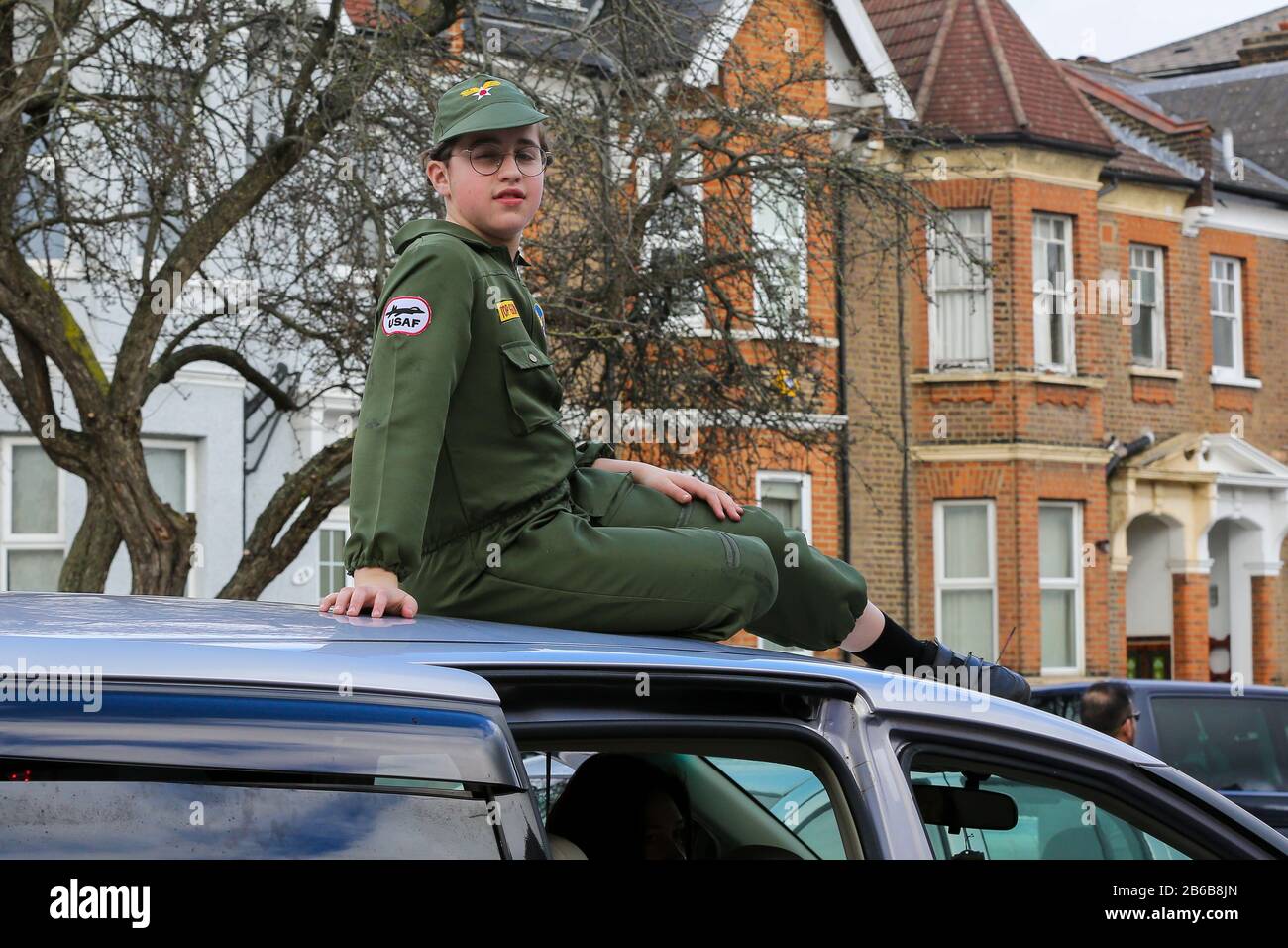 An Orthodox Jewish child dressed in an army uniform during the event ...